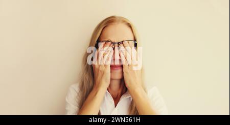 Tired overworked woman employee rubbing her eyes suffering from eye ...