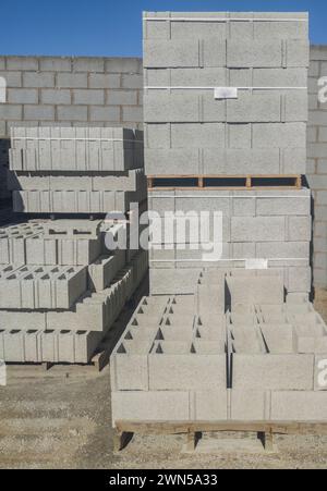 Full size hollow concrete blocks for plastering. Packed over wooden ...