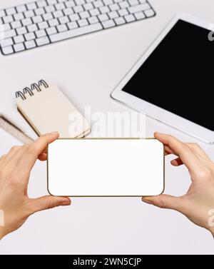 smart phone with empty screen and notepad on wooden background Stock ...