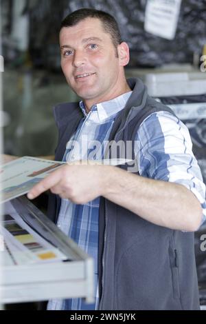 man in the process of offset printing and color correction Stock Photo ...