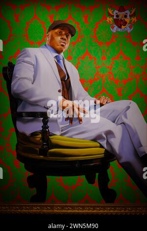 A painting of LL Cool J, center, by Kehinde Wiley, is seen in a gallery ...