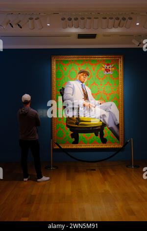 A painting of LL Cool J, center, by Kehinde Wiley, is seen in a gallery ...