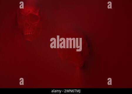 Silhouette of creepy ghost with skulls behind red cloth Stock Photo - Alamy