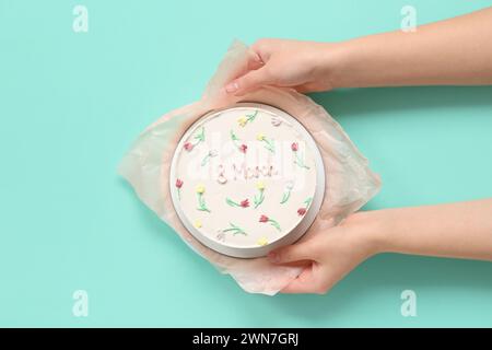 Female hands with sweet bento cake on white background. International ...