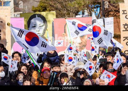 South Koreans march during a ceremony to celebrate the March First ...