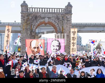 South Koreans march during a ceremony to celebrate the March First ...
