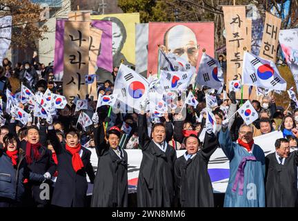 South Koreans march during a ceremony to celebrate the March First ...