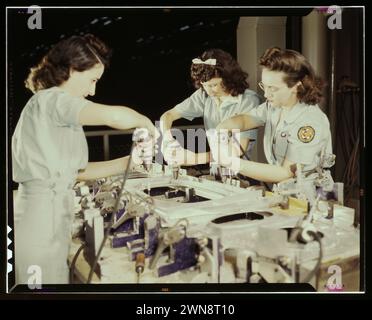 Vintage photographs of women welding parts of depth charge weapons in ...