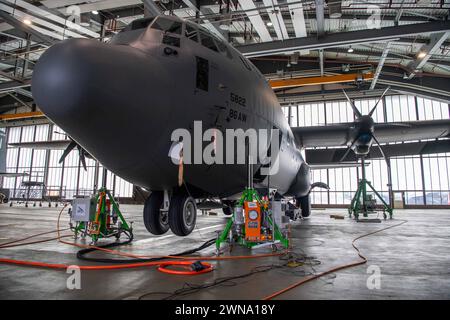 A C-130J Super Hercules is lifted using an electronic jacking and ...
