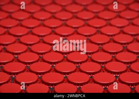 Red beer caps aligned in staggered pattern Stock Photo - Alamy