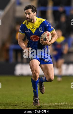 Toby King of Warrington Wolves makes a break during the Betfred Super ...