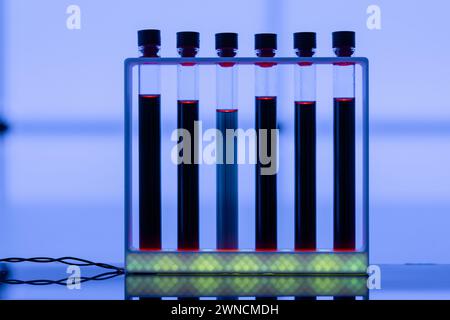samples of radioactive liquid in test tubes in a nuclear physics ...