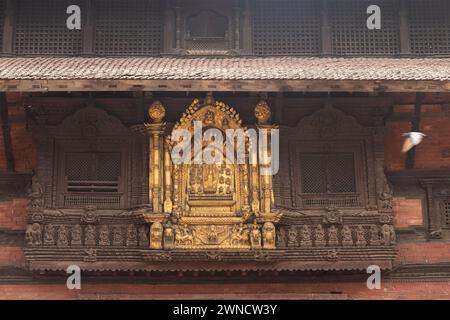 Carving of different Hindu gods and goddess above the entrance door to ...