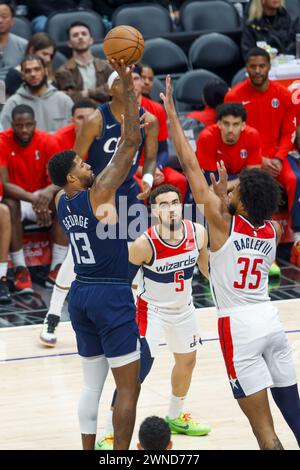 Washington Wizards' Marvin Bagley III, left, goes up for a shot against ...