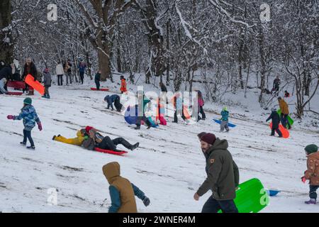Families enjoy sledding in the snow at the Mzaar-Kfardebian ski resort ...