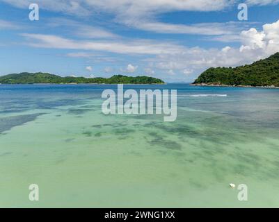 Cagbuli Island with beach and blue sea. Blue sky and clouds. El Nido ...