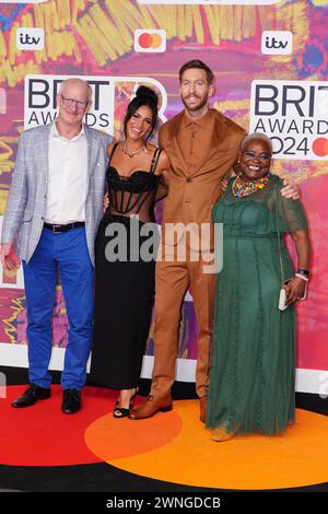 Vick Hope, left, and Calvin Harris pose for photographers upon arrival ...
