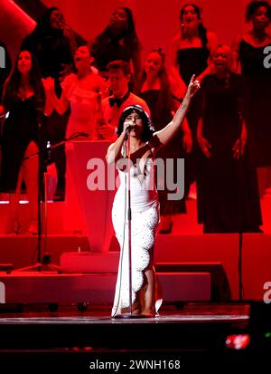 Raye performing on stage during the Brit Awards 2024 at the O2 Arena ...