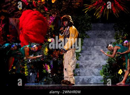 Rema performing on stage during the Brit Awards 2024 at the O2 Arena ...
