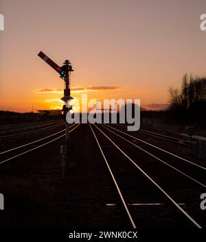 Railway upper quadrant semaphore signals with a golden sunset at ...