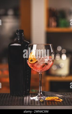 Bottle and glass of fresh grapefruit soda near swimming pool Stock ...
