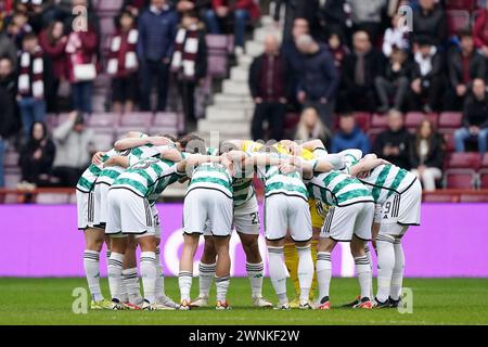 Celtic players form a huddle during the William Hill Premiership match ...