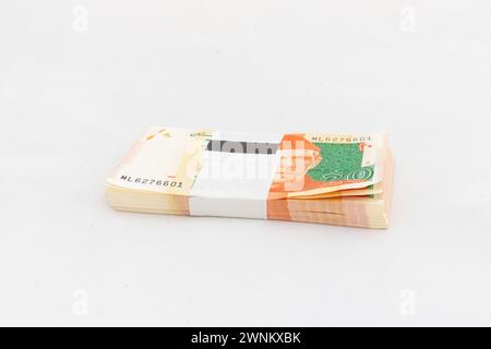 Twenty rupees banknote bundle of Pakistani currency on white isolated ...