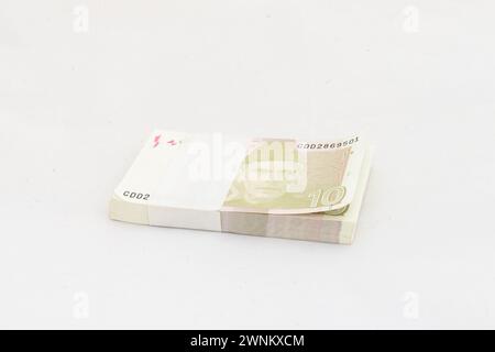 Pakistan ten rupees denomination note bundle on white isolated ...