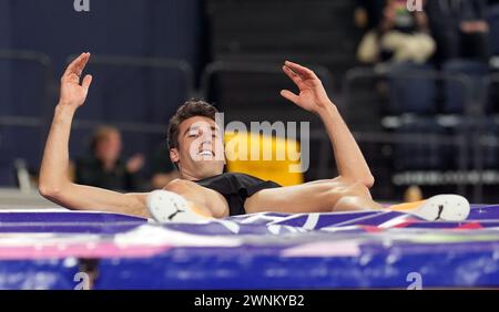 New Zealand's Hamish Kerr celebrates after winning the men's high jump ...