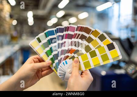Woman hands with color samples at printing press Stock Photo - Alamy