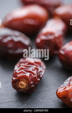 Dried dates are laid out slate board Stock Photo - Alamy