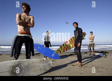 SURFERS- (L-R) Mike Kalish ( black Xcel wetsuit), twin brother Charlie ...