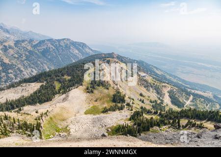 Switchback roads between ski runs on the face of the Rocky Mountains at ...