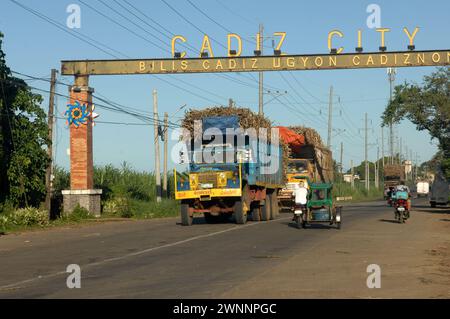 Overloaded trucks carrying sugarcane crop on road from Cadiz City to ...