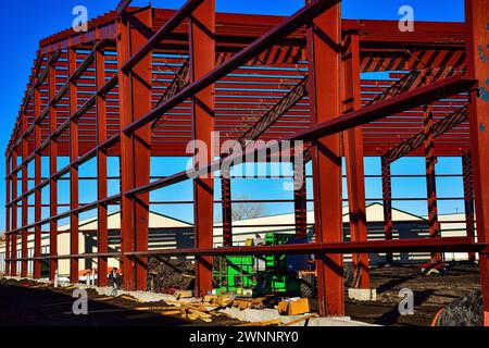 Heavy steel beams framing a new commercial building under construction ...