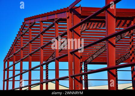 Heavy steel beams framing a new commercial building under construction ...