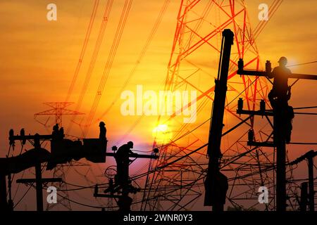 group of silhouette electric worker working on pole connected high ...