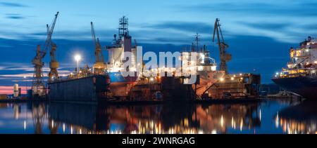 Ship repair at the ship repair yard at night Stock Photo - Alamy