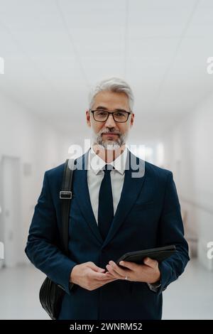 Portrait of pharmaceutical sales representative in medical building ...