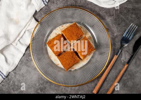 Cold baklava with biscuits. Cold baklava with biscuit filling on a dark ...