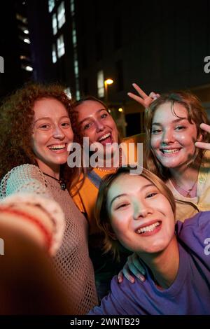 Group of friends enjoy a gathering outdoors. They share laughter and ...