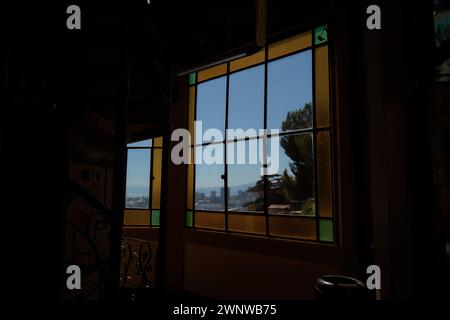 the view of Genoa through the stained glass window of the funicular ...
