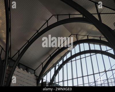 Arches and arches of the station. Metal structures under the roof of a ...