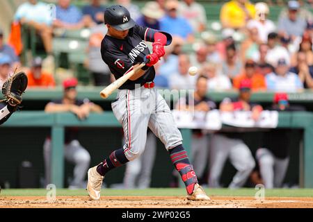 Minnesota Twins shortstop Brooks Lee (2) throws to first base during an ...