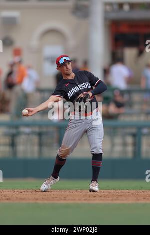 Minnesota Twins shortstop Brooks Lee (2) throwing during an MLB Spring ...