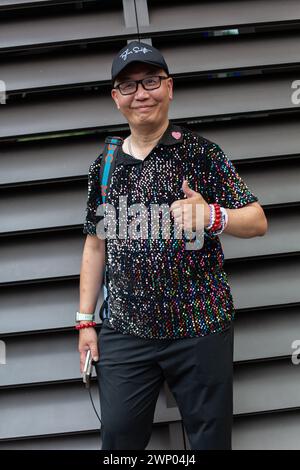 3 March 2024. A Swifties male fan dress in pink top and pink sneakers ...