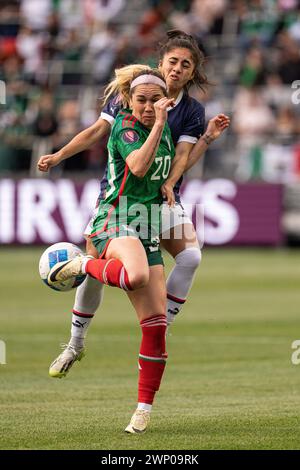 Mexico forward Mayra Pelayo (20) scores a goal against Dominican ...