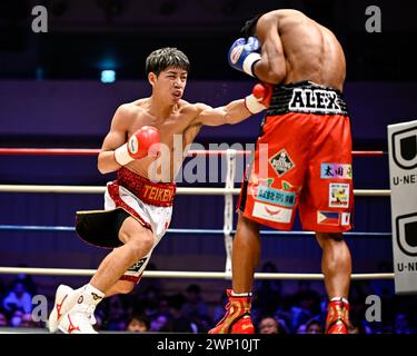 Subaru Murata (red gloves) of Japan and Alex Santisima Jr. (blue gloves) of the Philippines ...