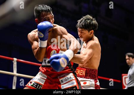 Subaru Murata (red gloves) of Japan and Alex Santisima Jr. (blue gloves) of the Philippines ...