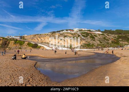 Sintra, Portugal: February 17, 2024: People at the beach of Magoito in ...